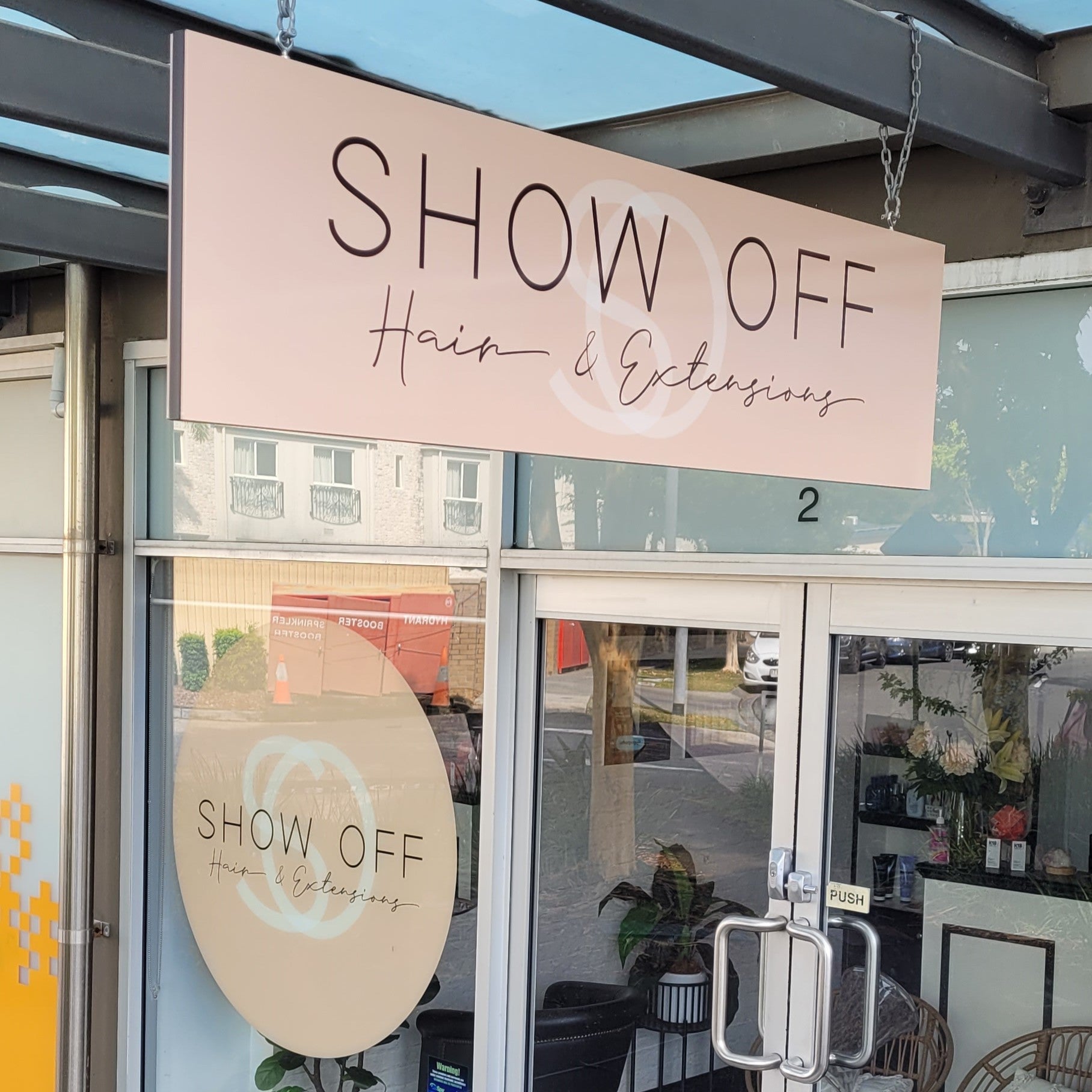 Shop front signage - combining window graphics and hanging sign