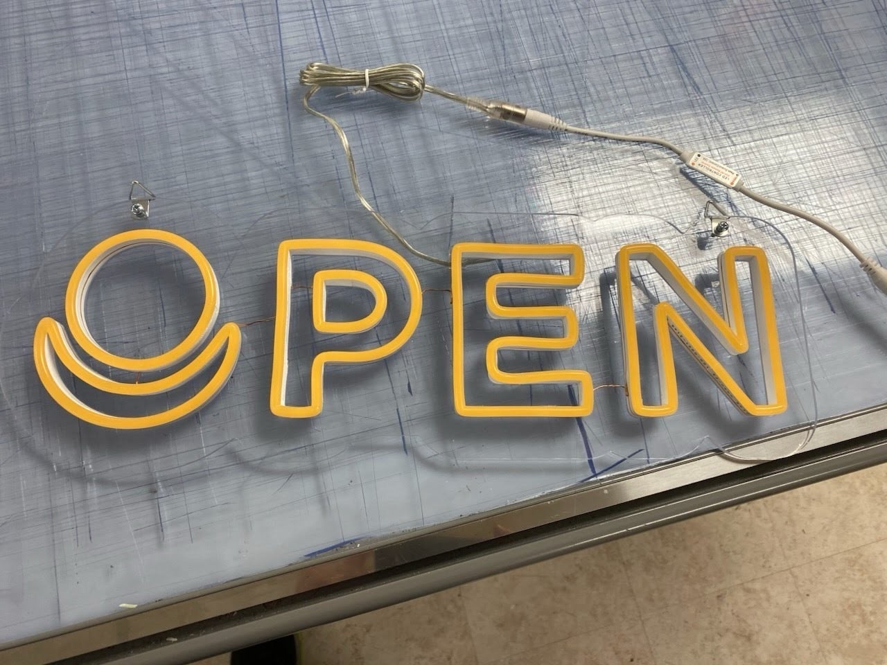Branded Neon Sign Installed at Apparati Tysons – Featuring Sun & Moon Logo