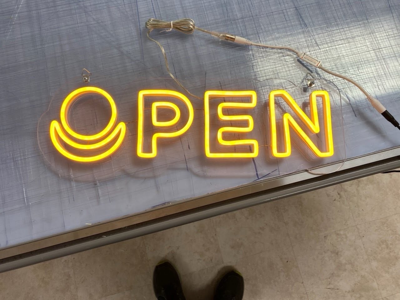 Branded Neon Sign Installed at Apparati Tysons – Featuring Sun & Moon Logo