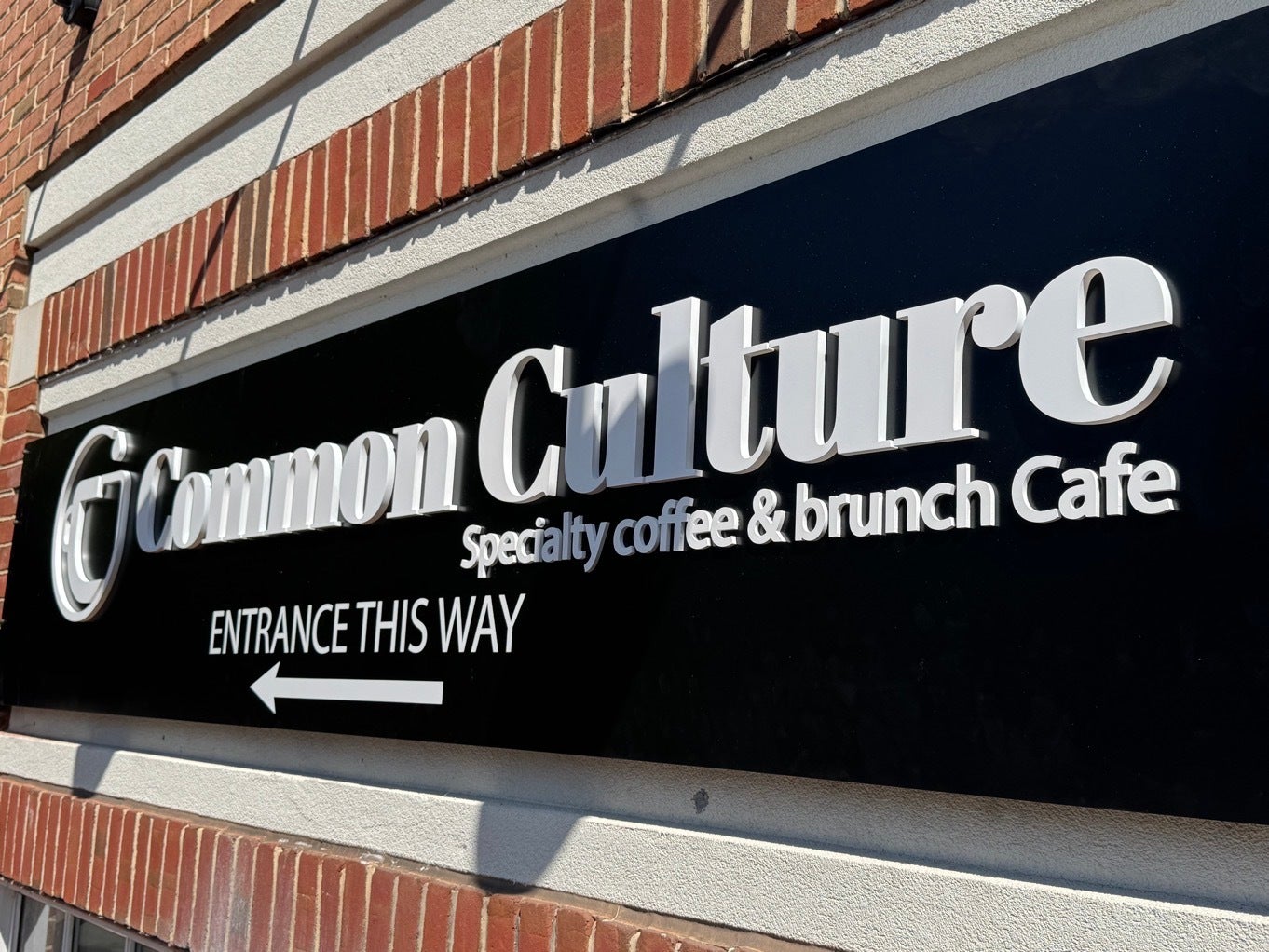 Sleek Black and White Acrylic Sign for Common Culture Coffee in Fairfax