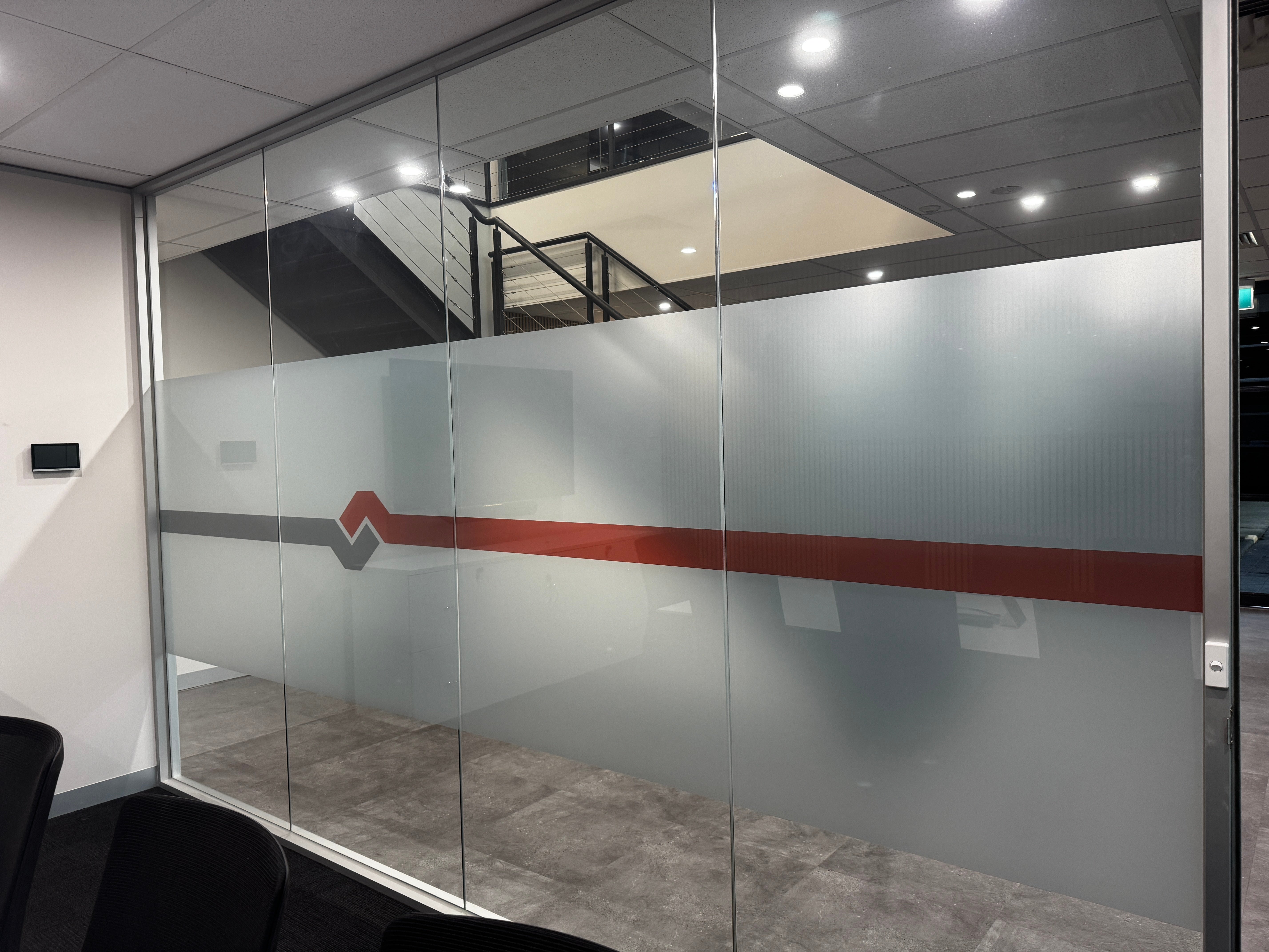 From Windows to Walls: A Full Signage Refresh for a Telecommunications Team
