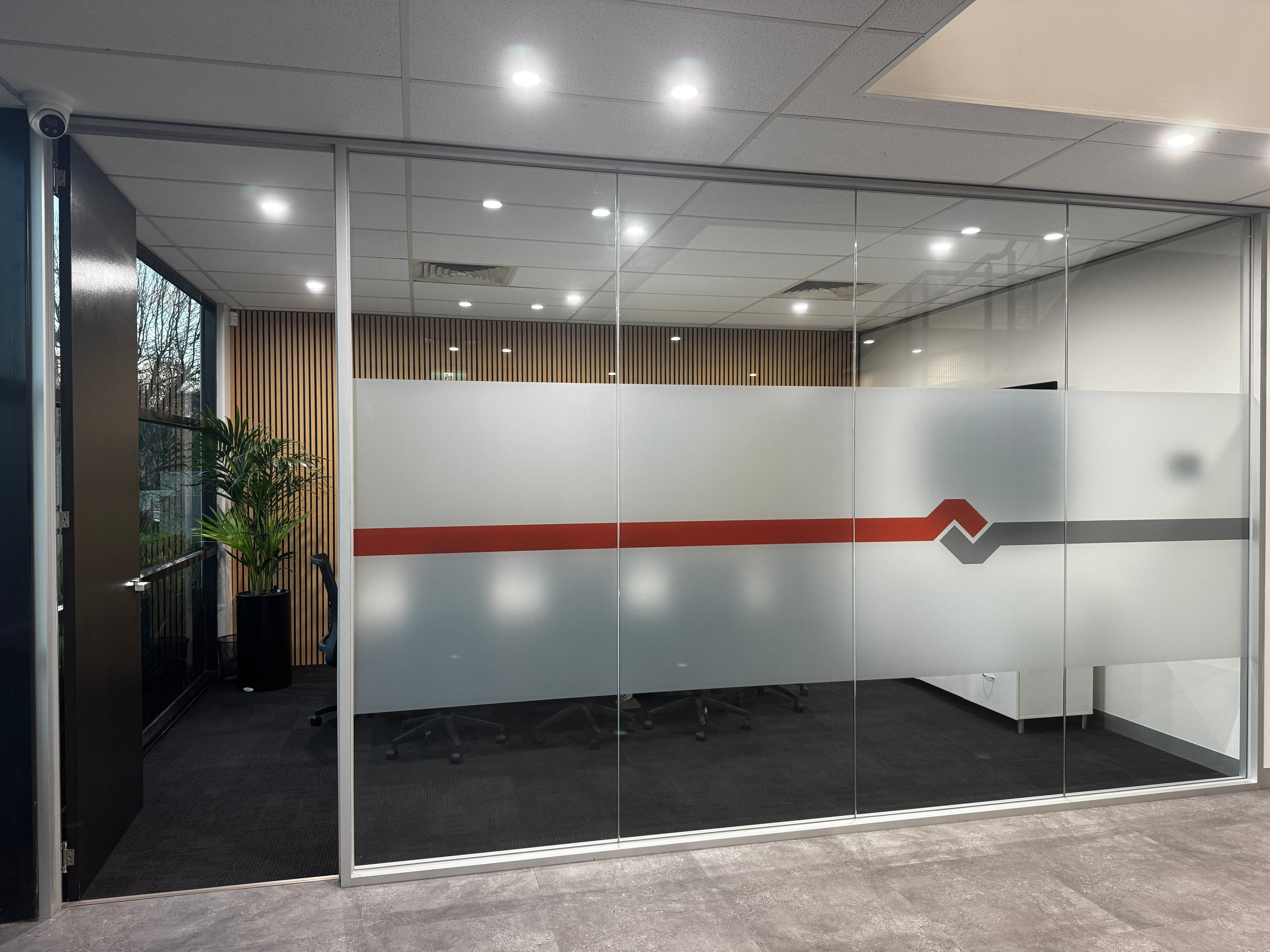 From Windows to Walls: A Full Signage Refresh for a Telecommunications Team