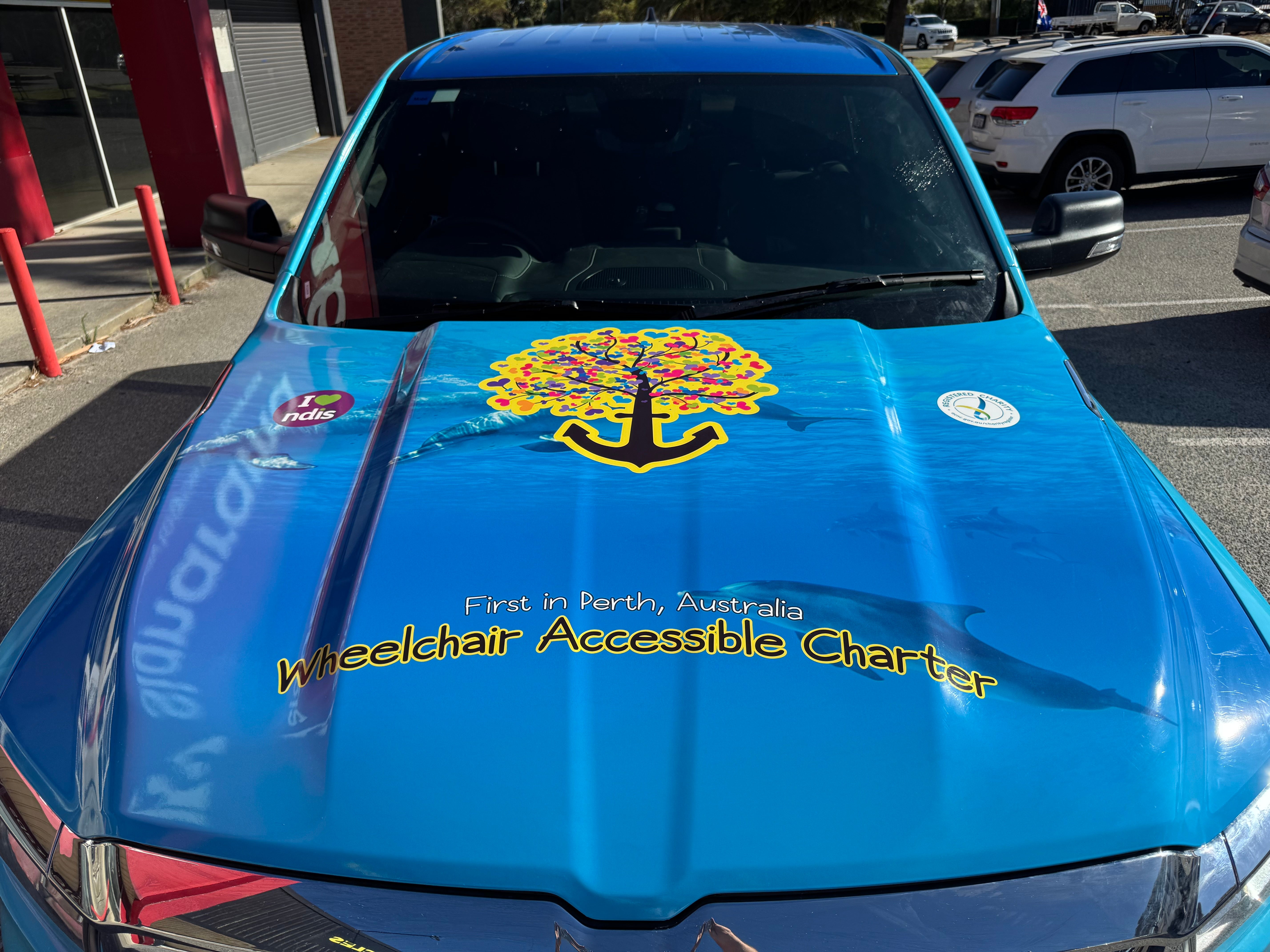 Vibrant Vehicle Wrap for No Limitts Charters by Signarama Malaga