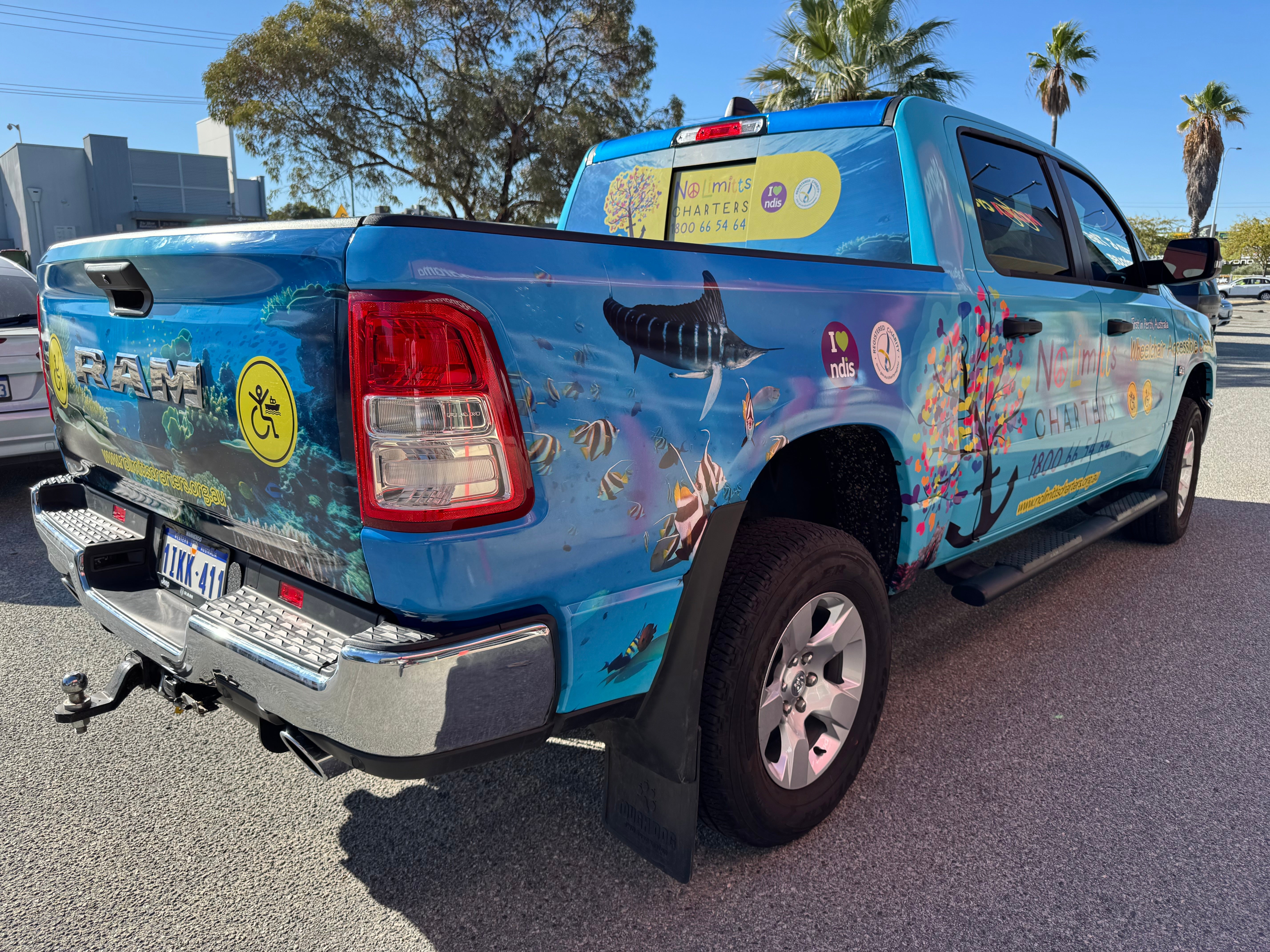 Vibrant Vehicle Wrap for No Limitts Charters by Signarama Malaga
